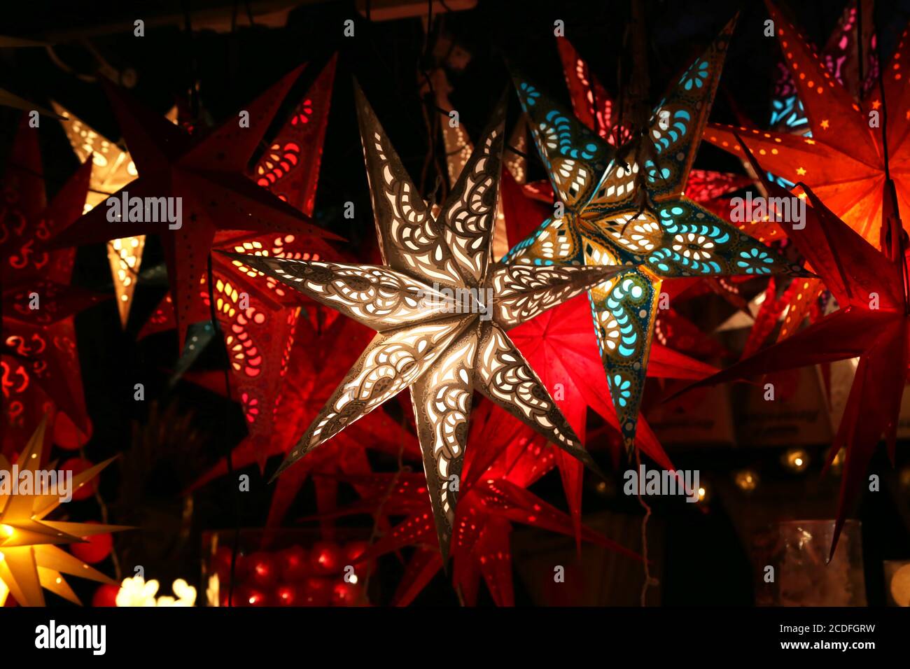 Closeup of glowing colorful Christmas stars, beautiful decorations ...