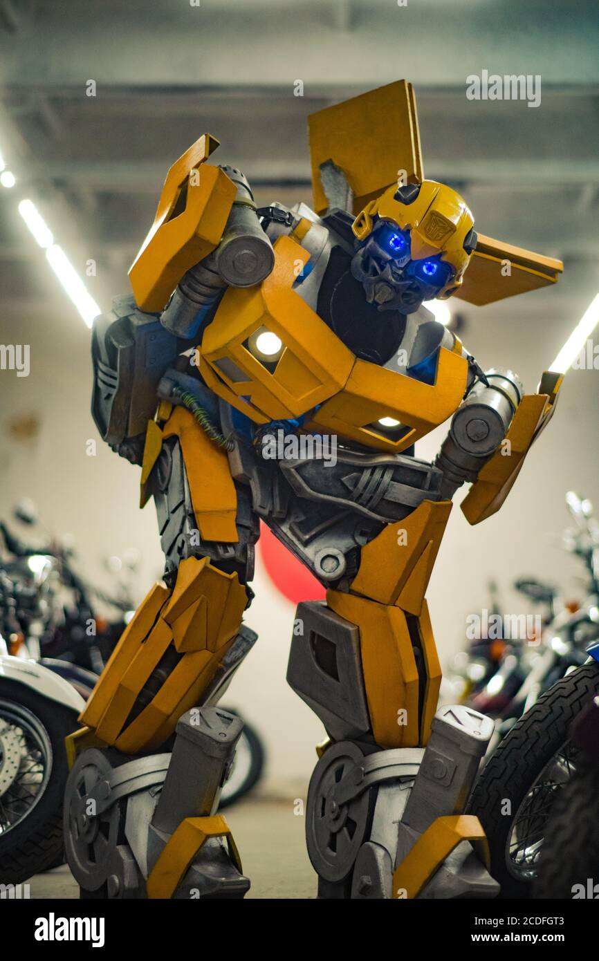 Robot transformer stands in garage Stock Photo - Alamy