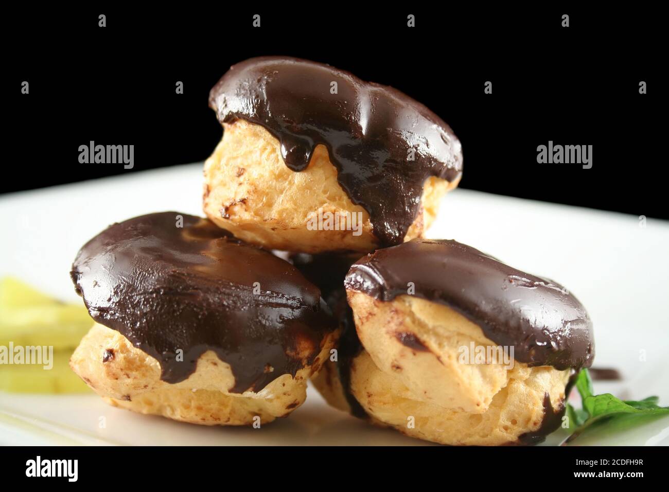 Chocolate Profiteroles Stack Stock Photo - Alamy