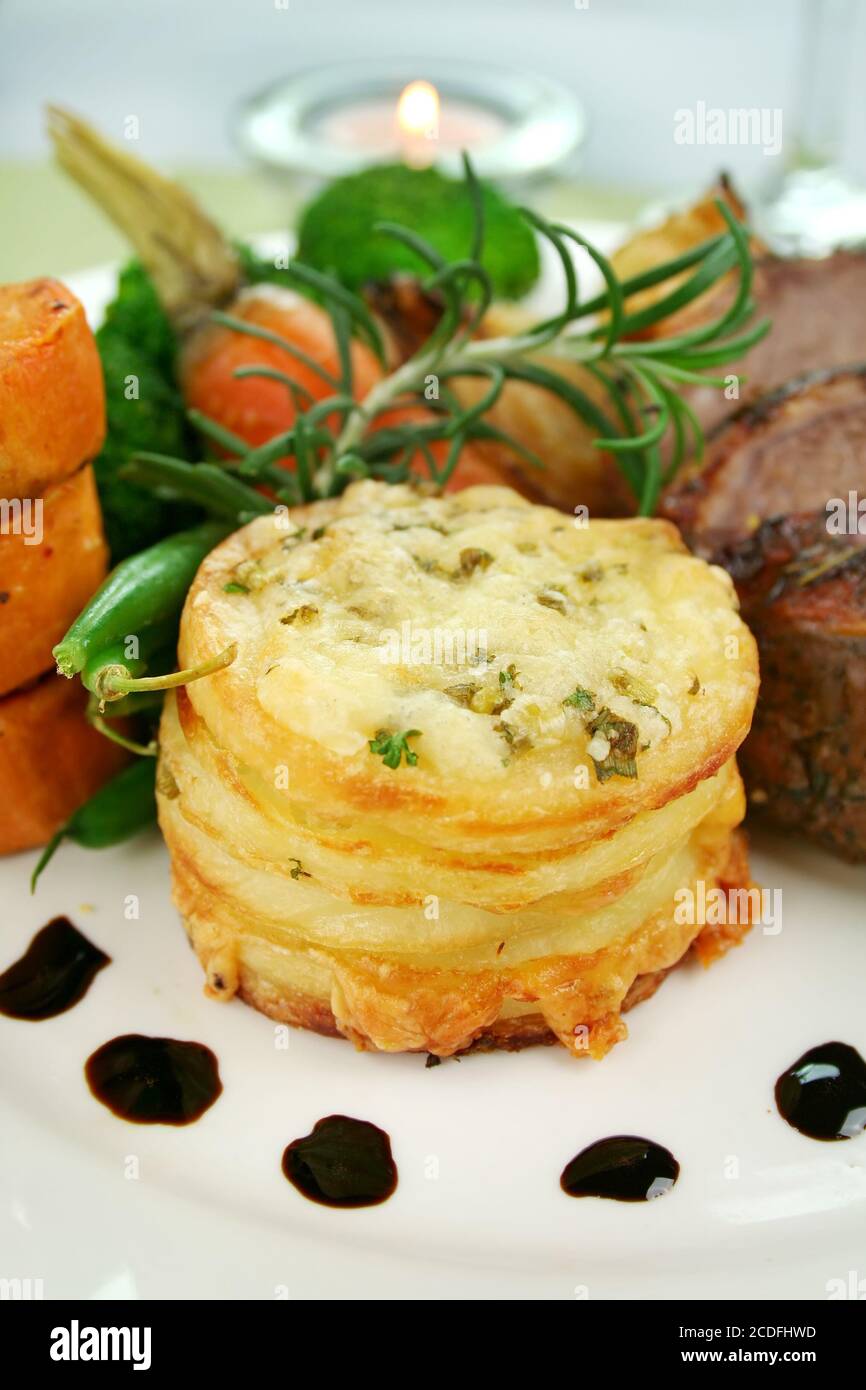 Potato Stack And Baked Vegetables Stock Photo - Alamy