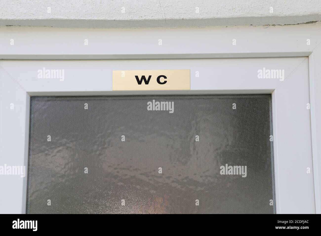 Closeup of WC label above the toilet room Stock Photo - Alamy