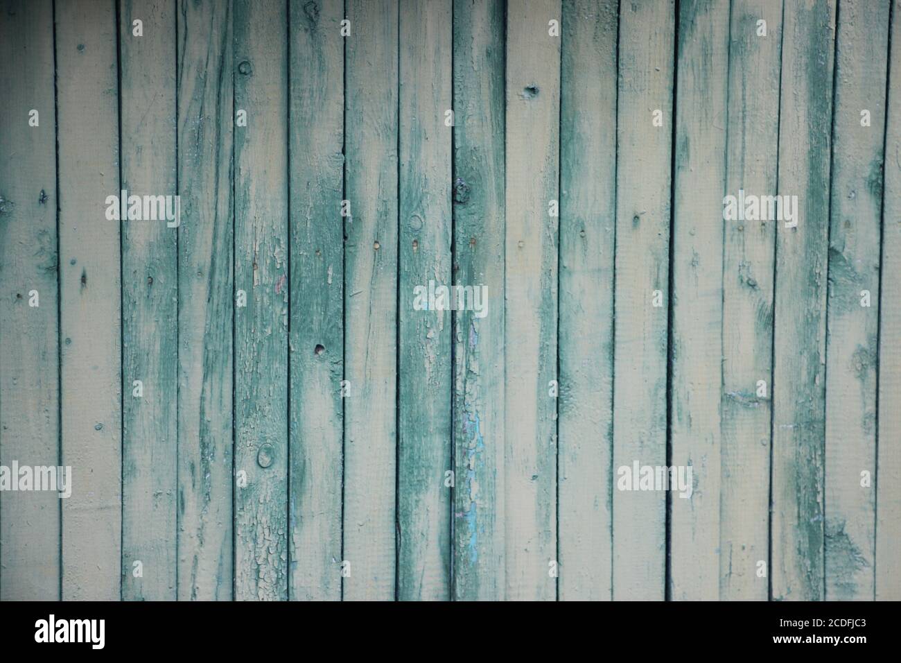 old wooden weathered planks painted into green with horizontal boards ...