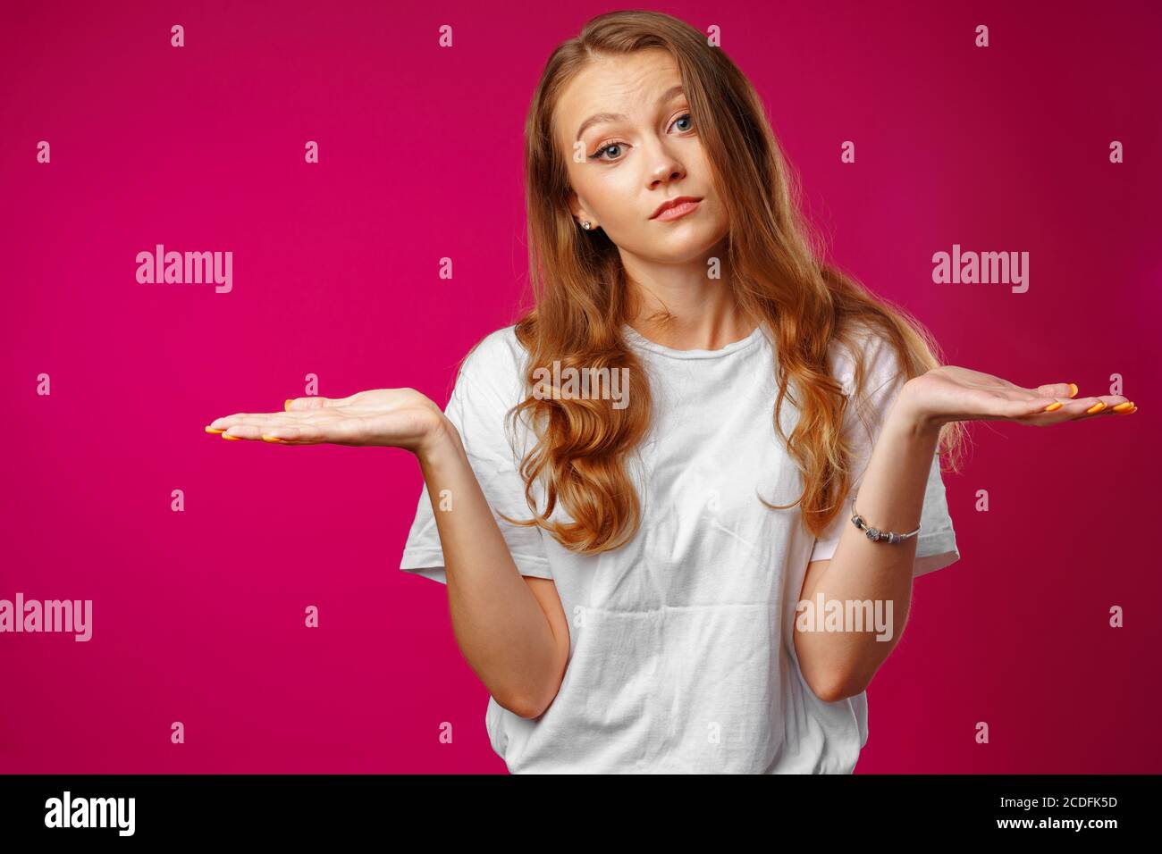 Young caucasian girl making do not know sign Stock Photo - Alamy