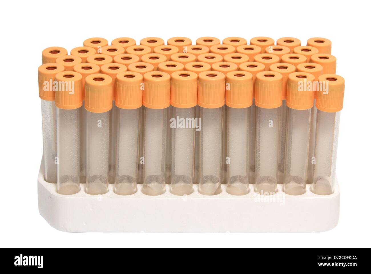 test tubes with orange covers in rack isolated on white Stock Photo - Alamy
