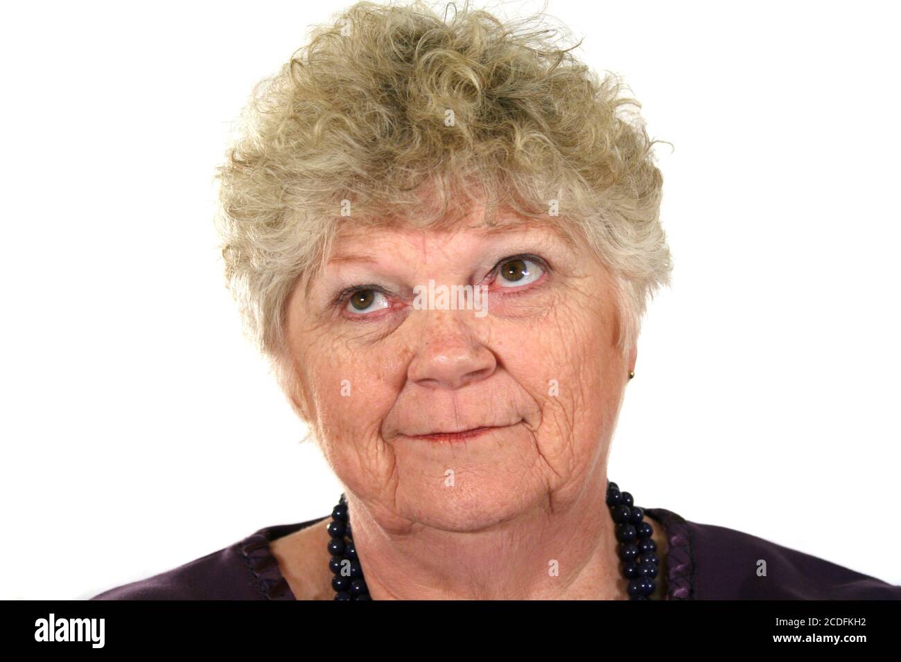 Thoughtful senior woman gazing hi-res stock photography and images - Alamy