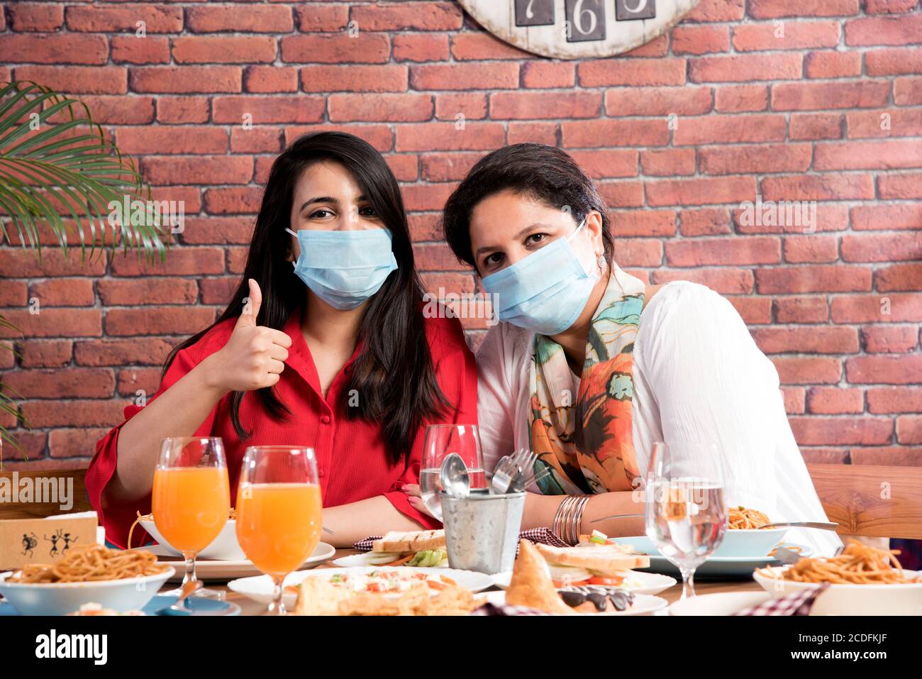 Indian asian friends Eating in Restaurant Dining Concept wearing ...