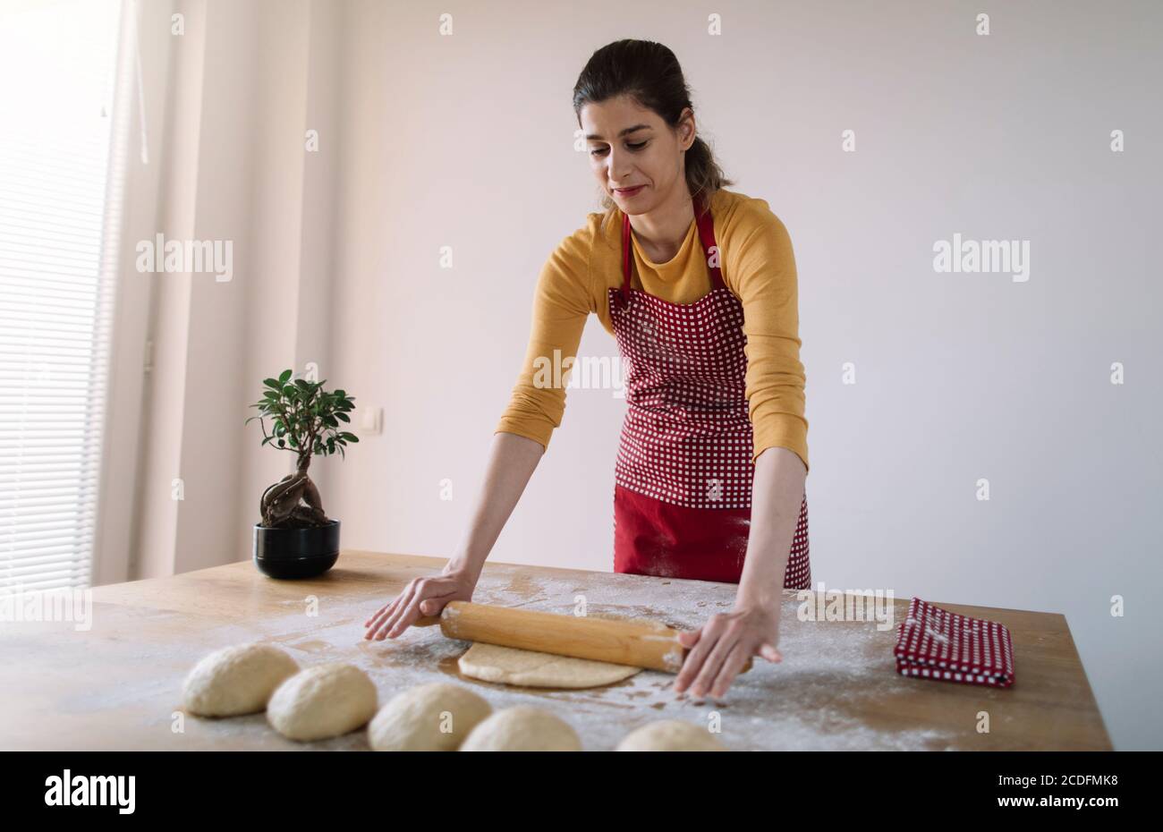 Woman kneading bread dough hi-res stock photography and images - Alamy