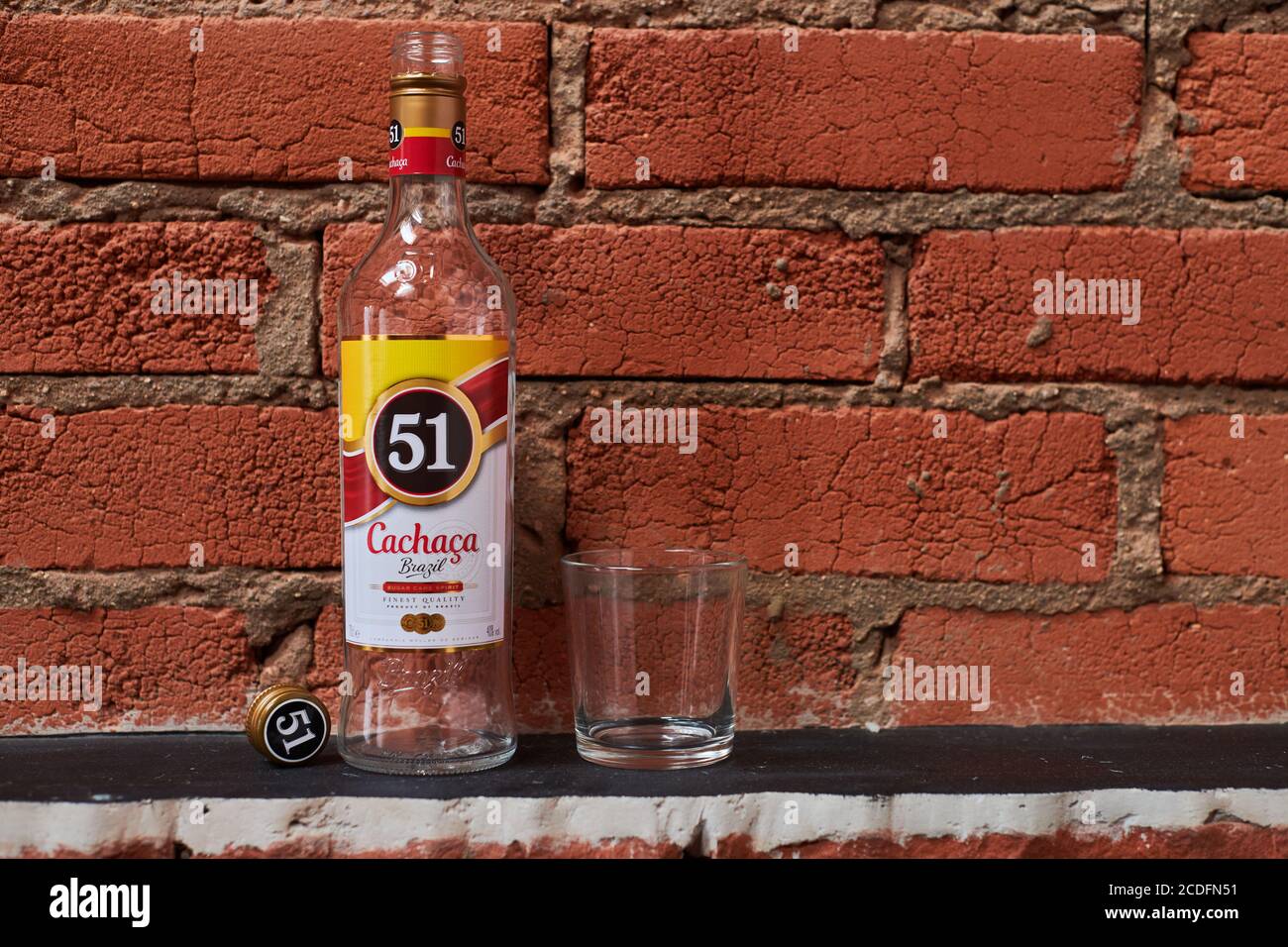Moscow - 23.11.2019 - Cachaca 51 bottle with glass. Brazilian rum ...