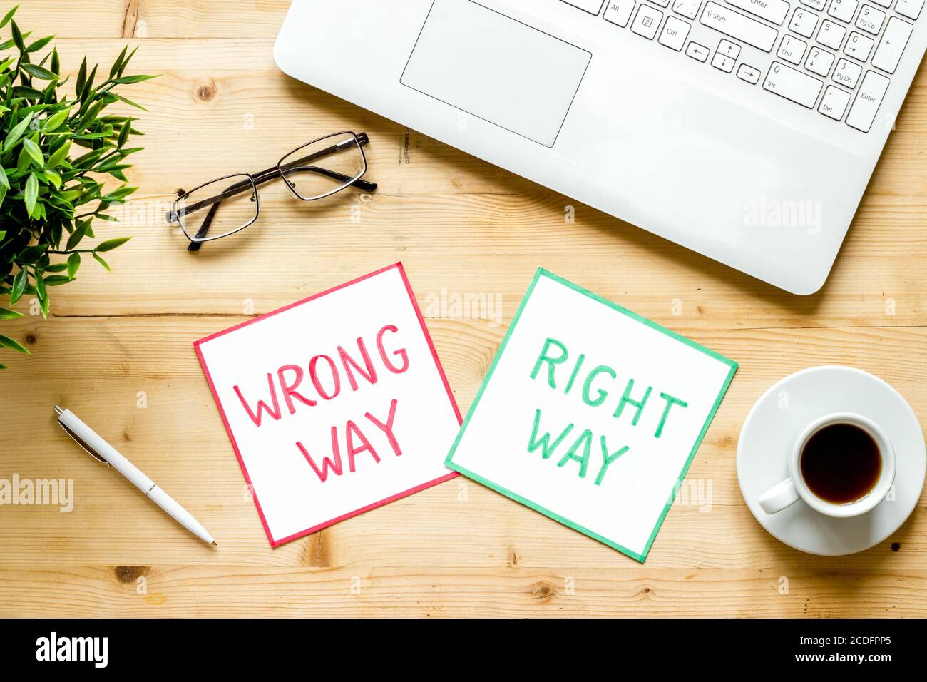 Problem solving. Right and wrong way icons on work desk from above ...