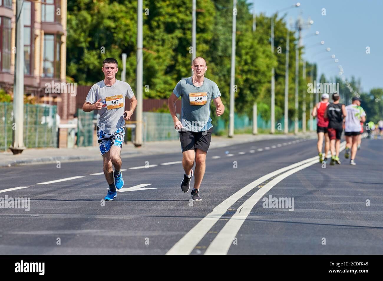 Voronezh, Russia - 24.08.2019 - Marathon runners on city road. Running ...