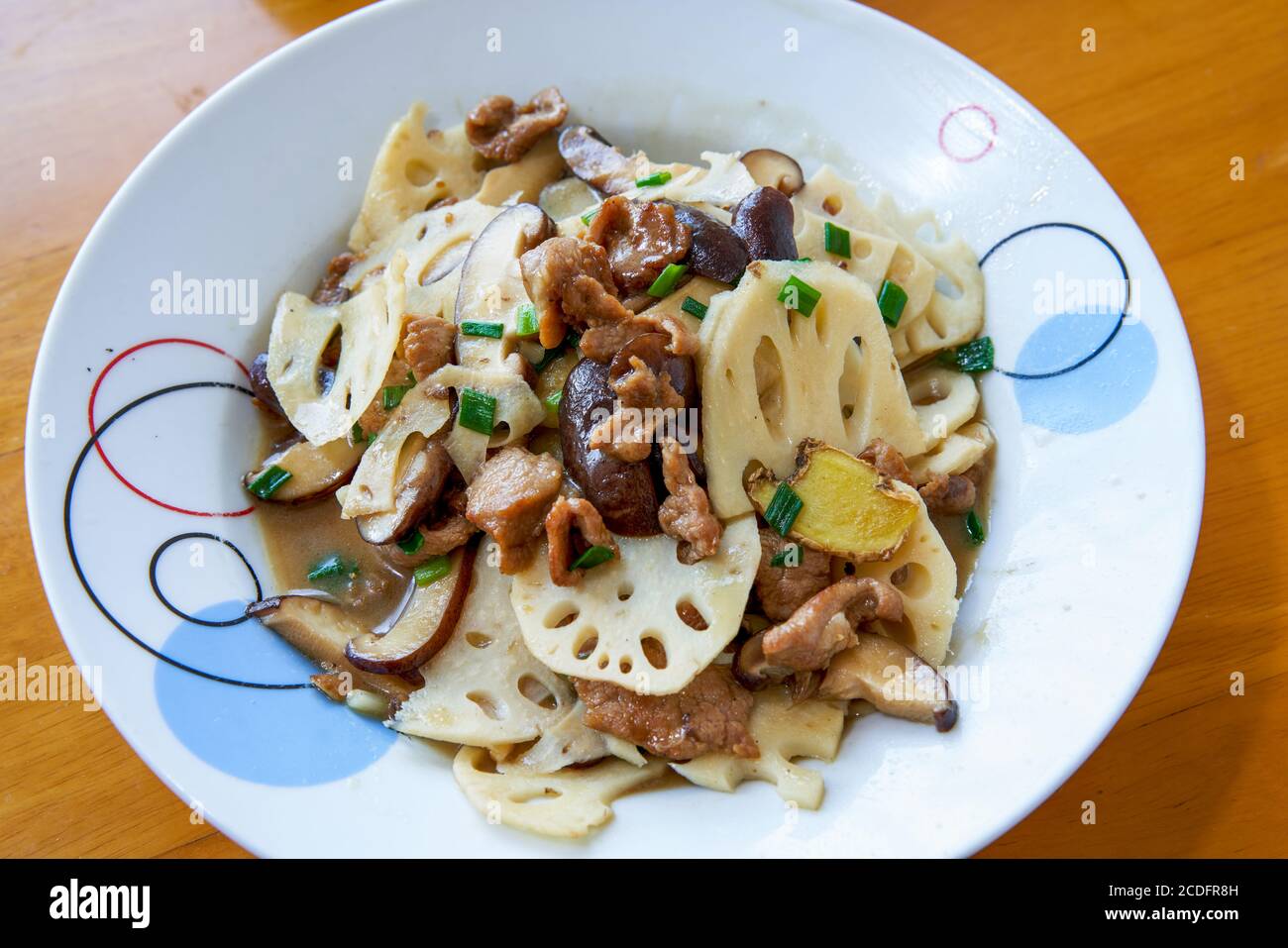 Chinese common dish, fried pork with lotus root Stock Photo - Alamy