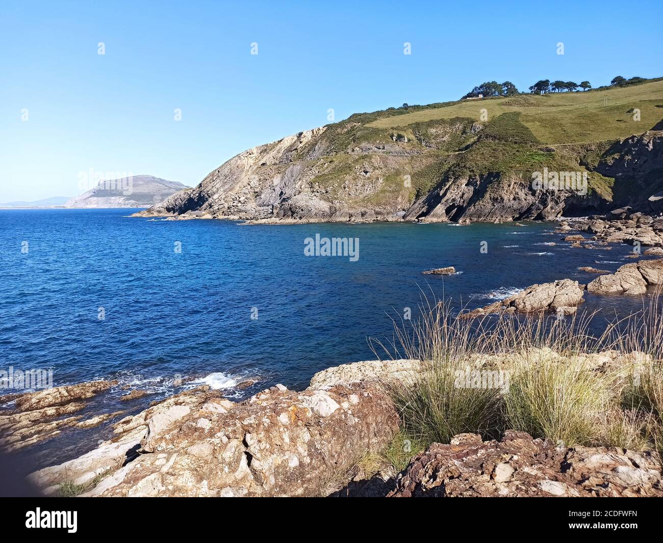 Beautiful rocky coastline with a seascape view in sunlight Stock Photo ...