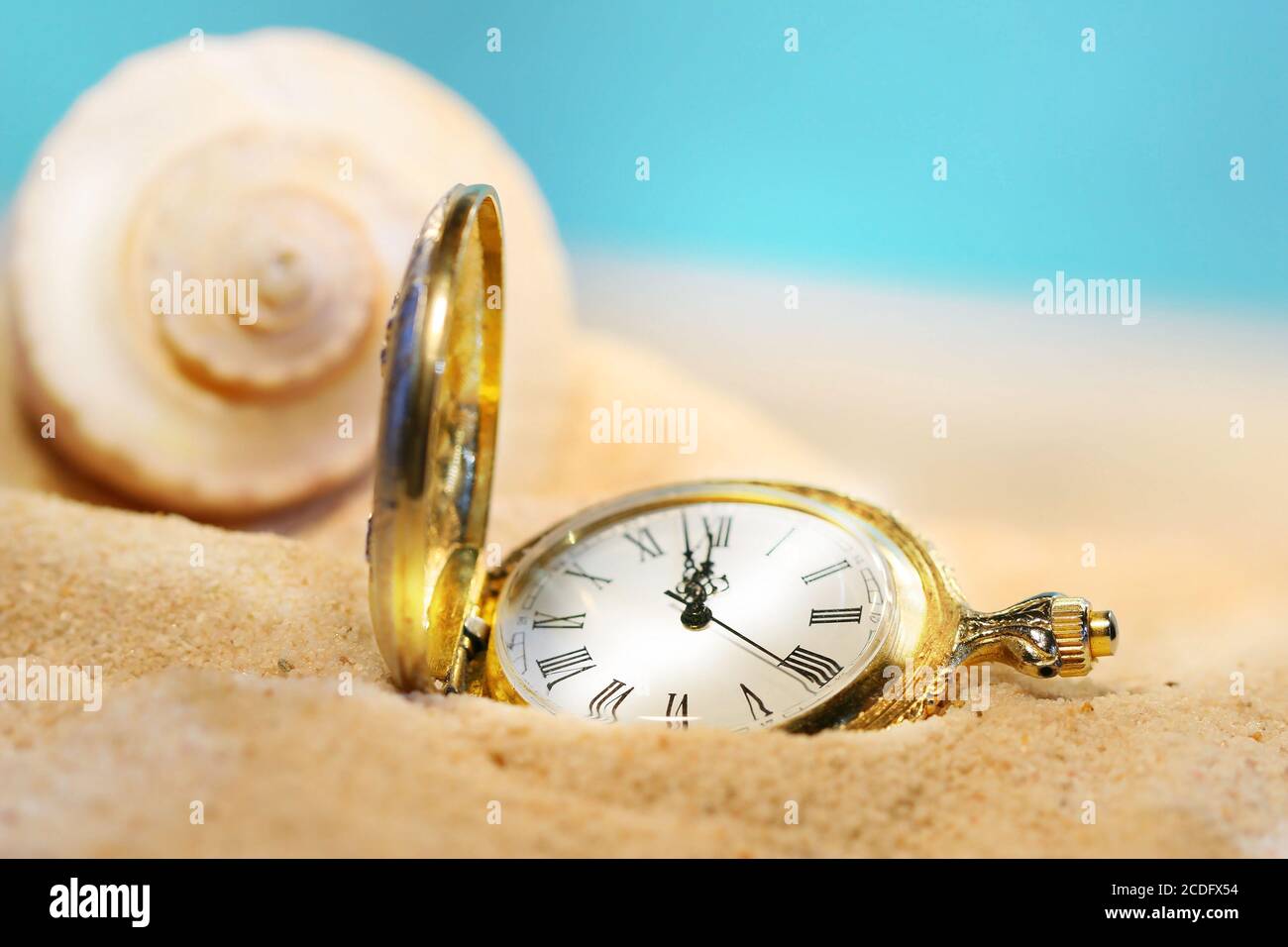 Watch lost in the sand Stock Photo - Alamy