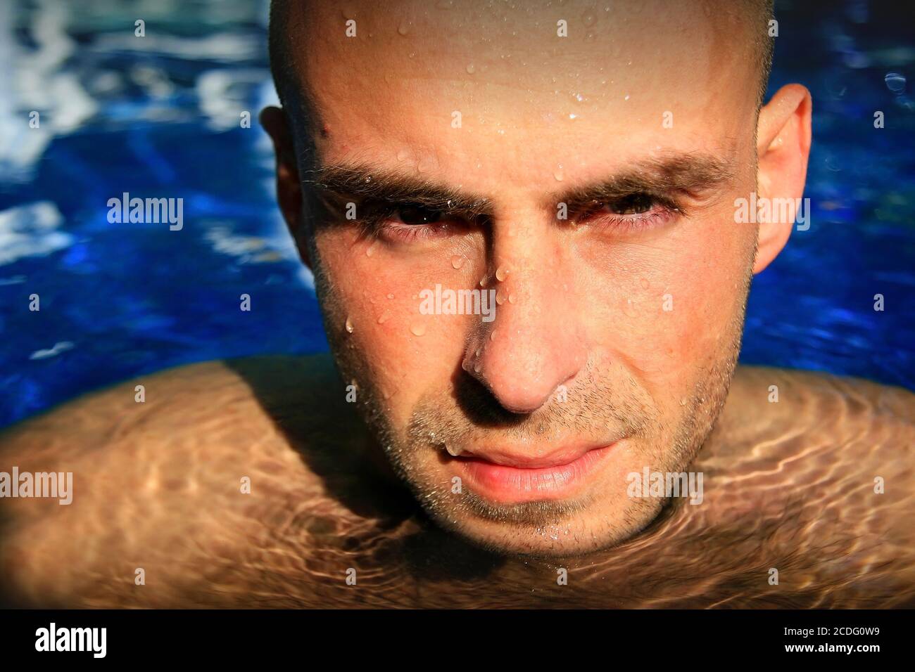 Man gazing while in water Stock Photo - Alamy