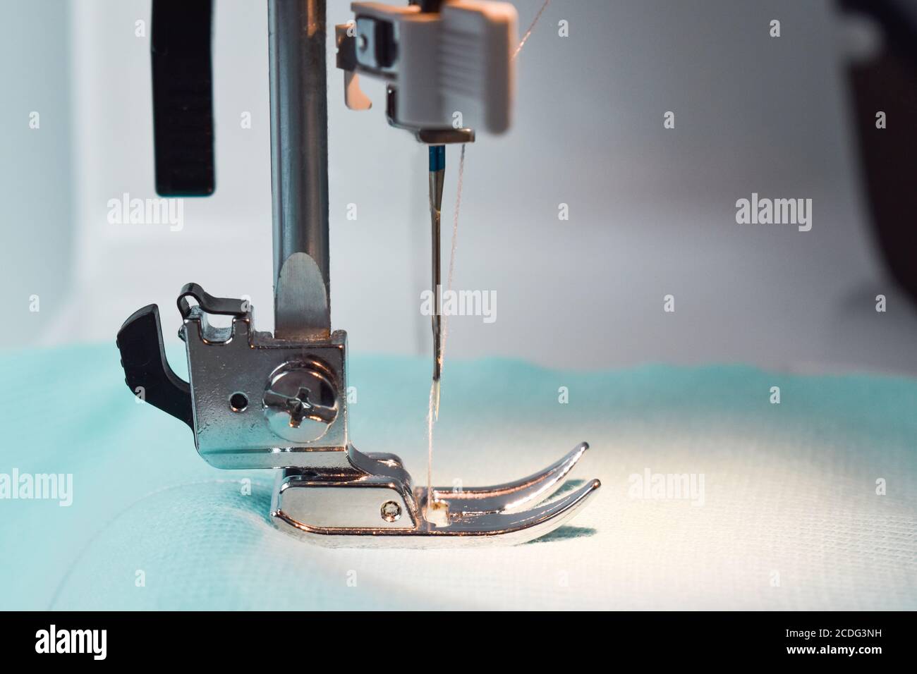 The needle of the sewing machine closeup Stock Photo - Alamy