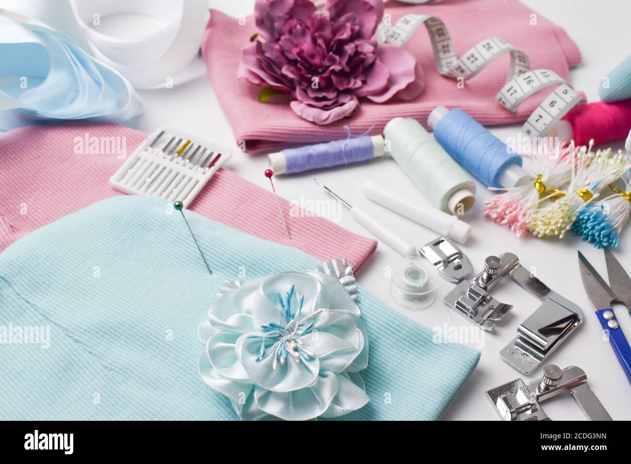 Sewing accessories and spare parts from a sewing machine on a white ...