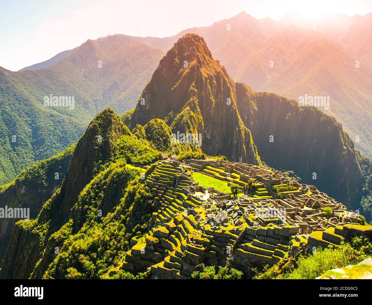 Ancient Inca City of Machu Picchu illuminated by sun. Ruins of Incan ...