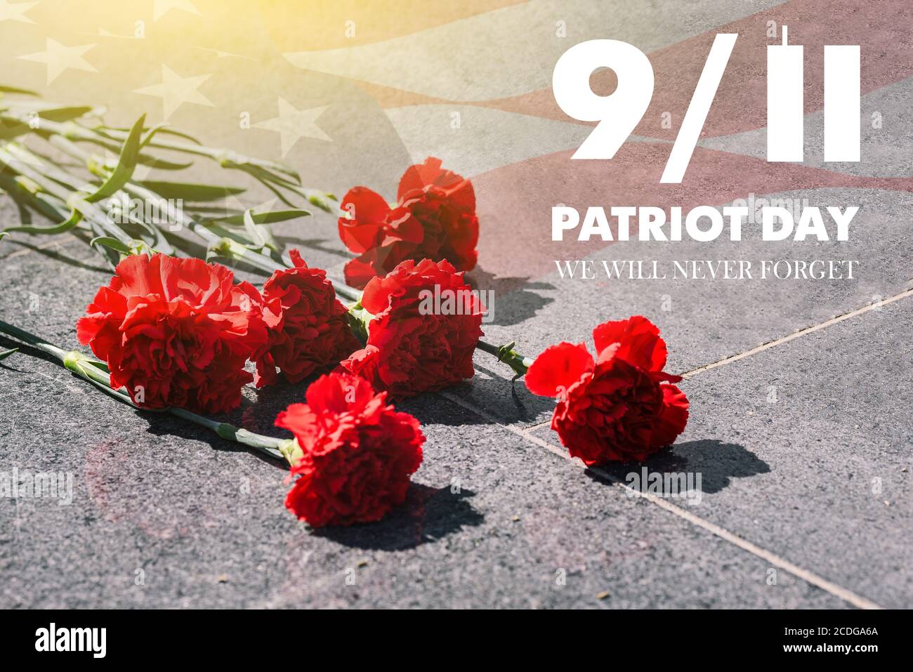 Carnations on the memorial with the American flag. Patriots ' day ...