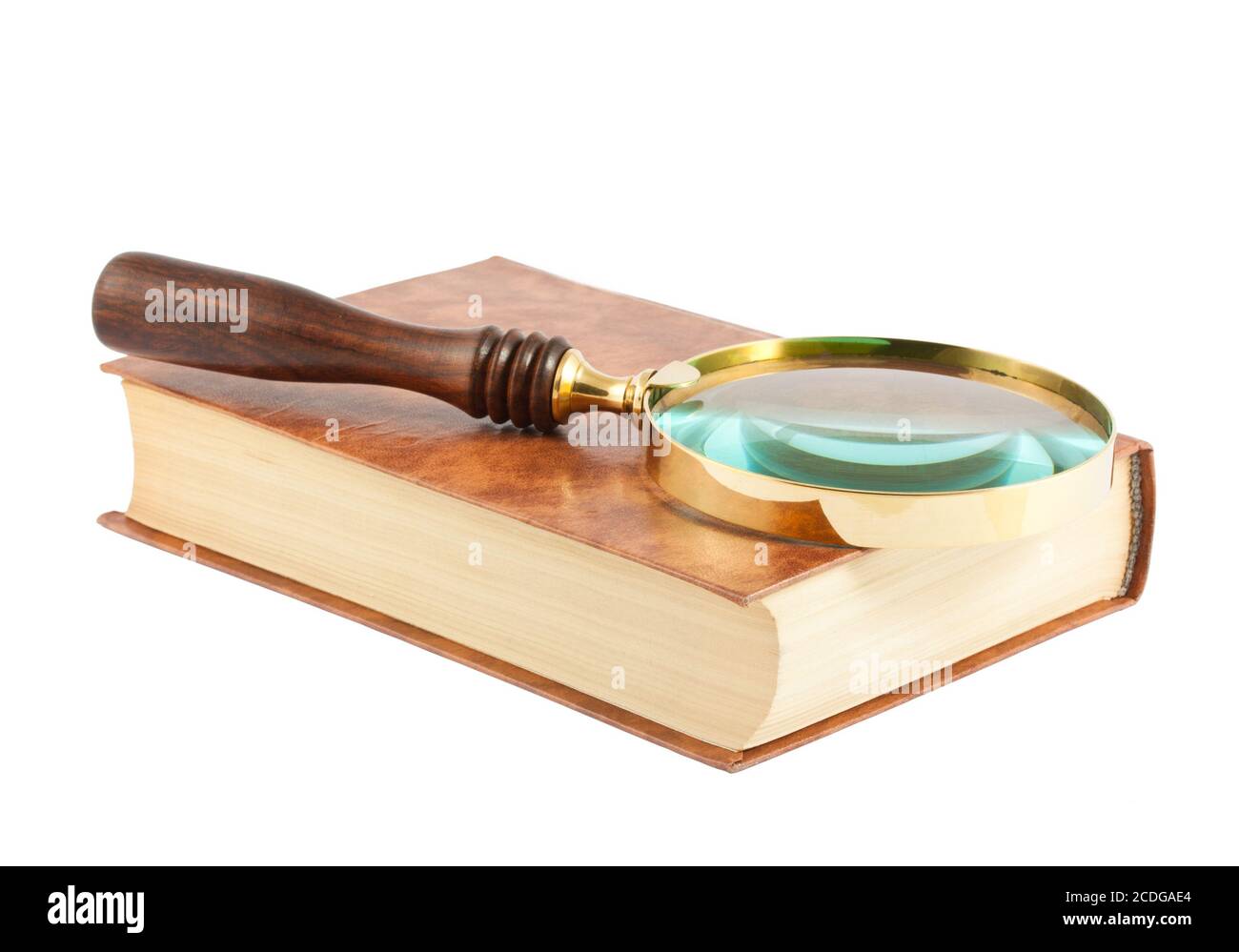 Magnifying glass on the book Stock Photo - Alamy