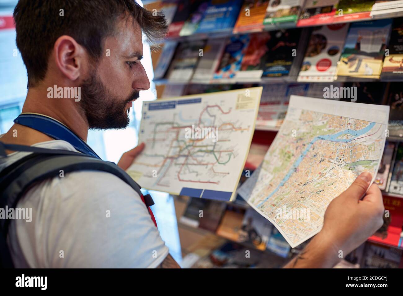 Young Man looking map city.Travel planning concept on map Stock Photo ...