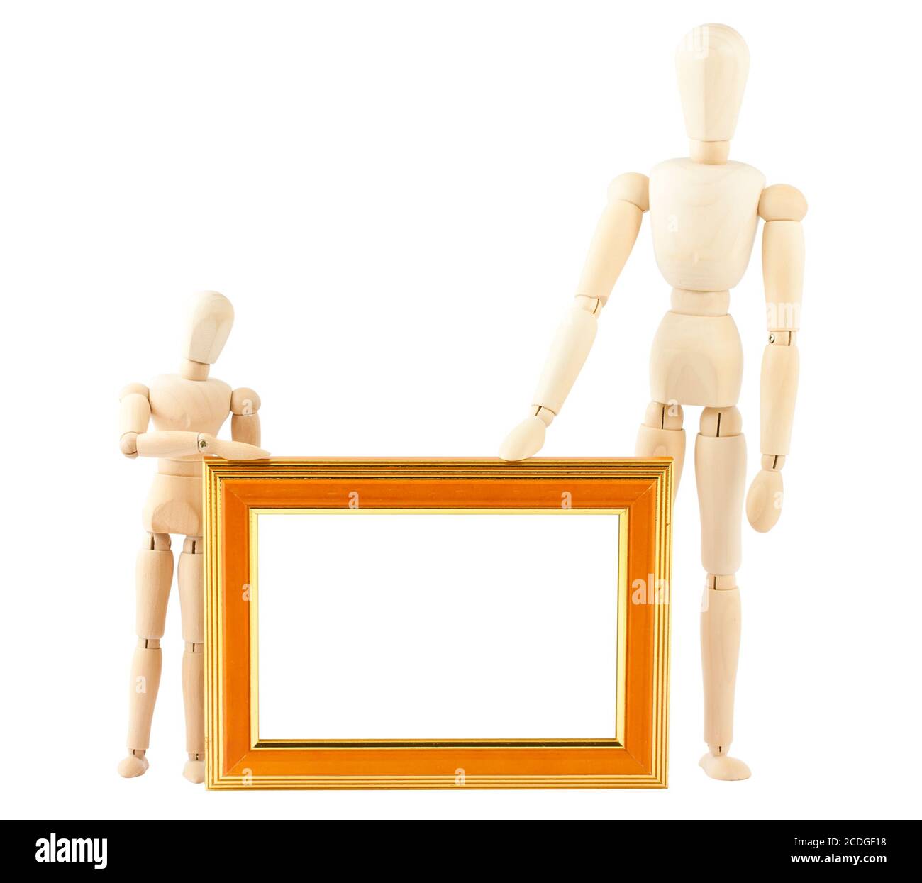 Two wooden dummy and empty frame Stock Photo - Alamy