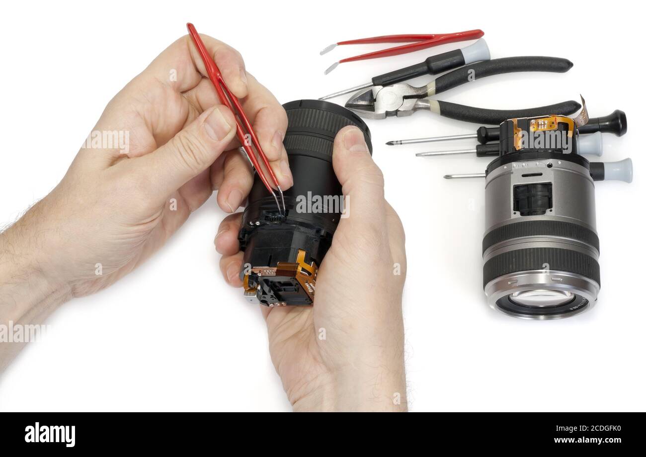 Repair of a lens of the digital camera Stock Photo - Alamy