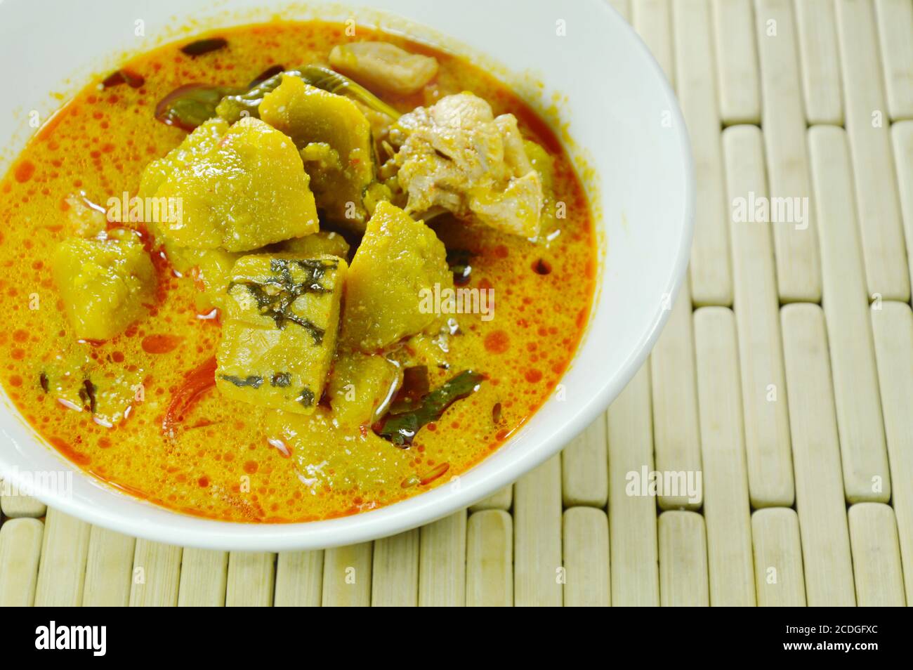 spicy boiled pumpkin with chicken in curry on bowl Stock Photo - Alamy