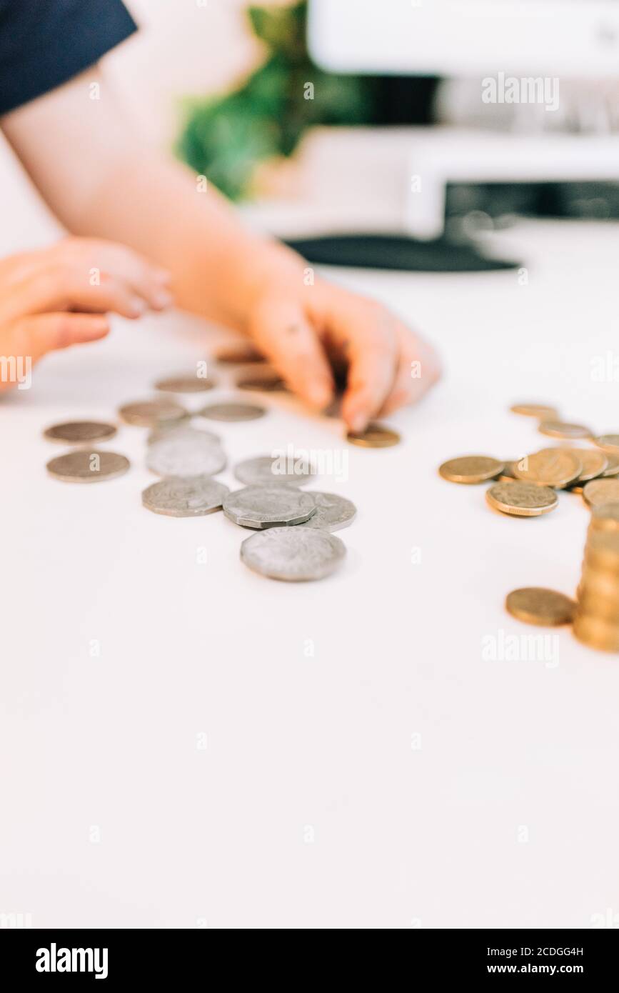 Closeup shot of a hand and coins isolated on white background Stock ...