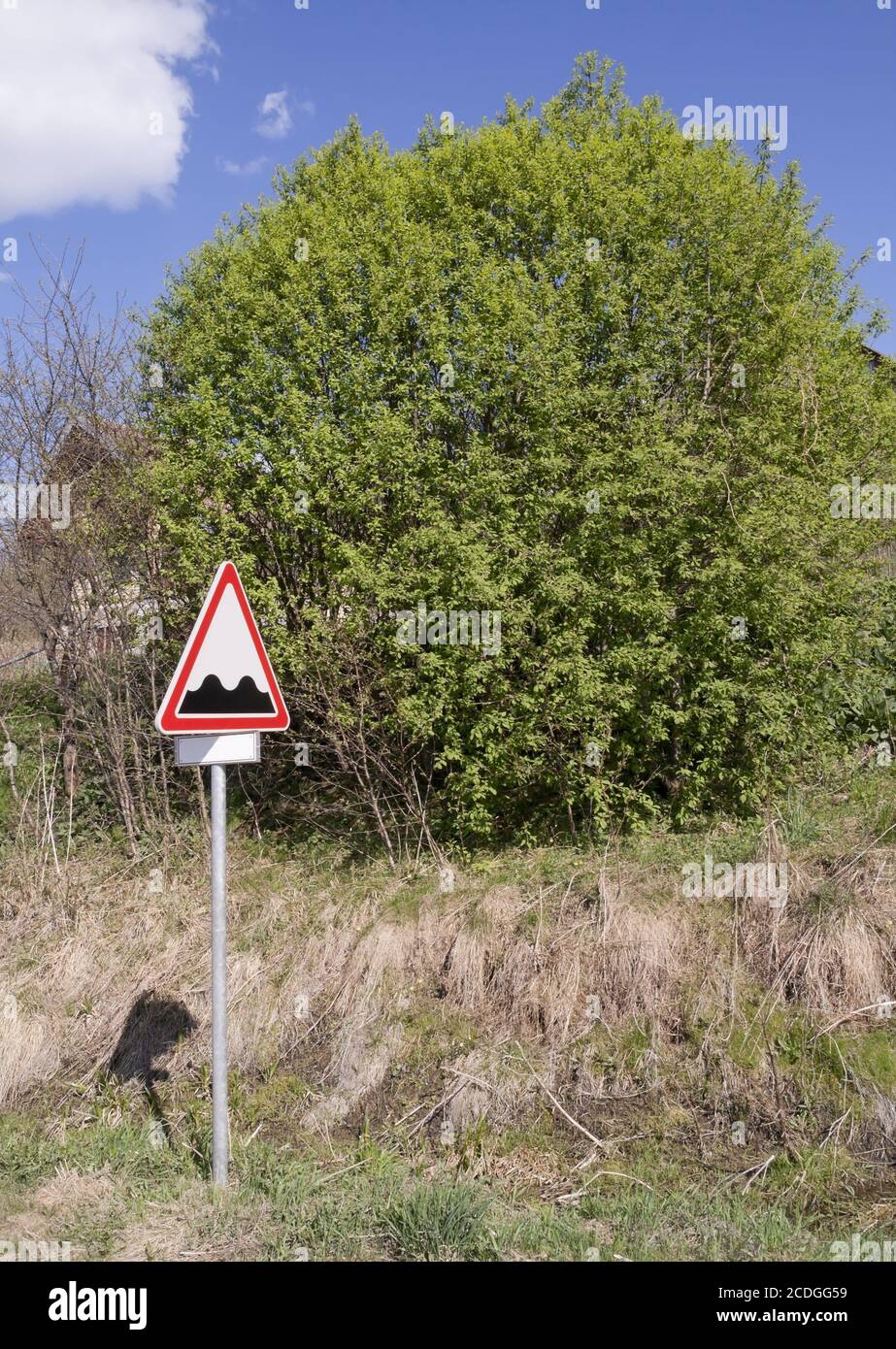 Traffic sign Bumpy road Stock Photo - Alamy