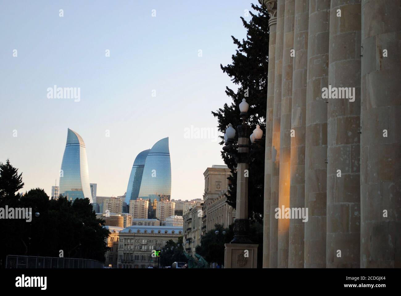 The Old City classic buildings in Baku with modern Flame Towers ...