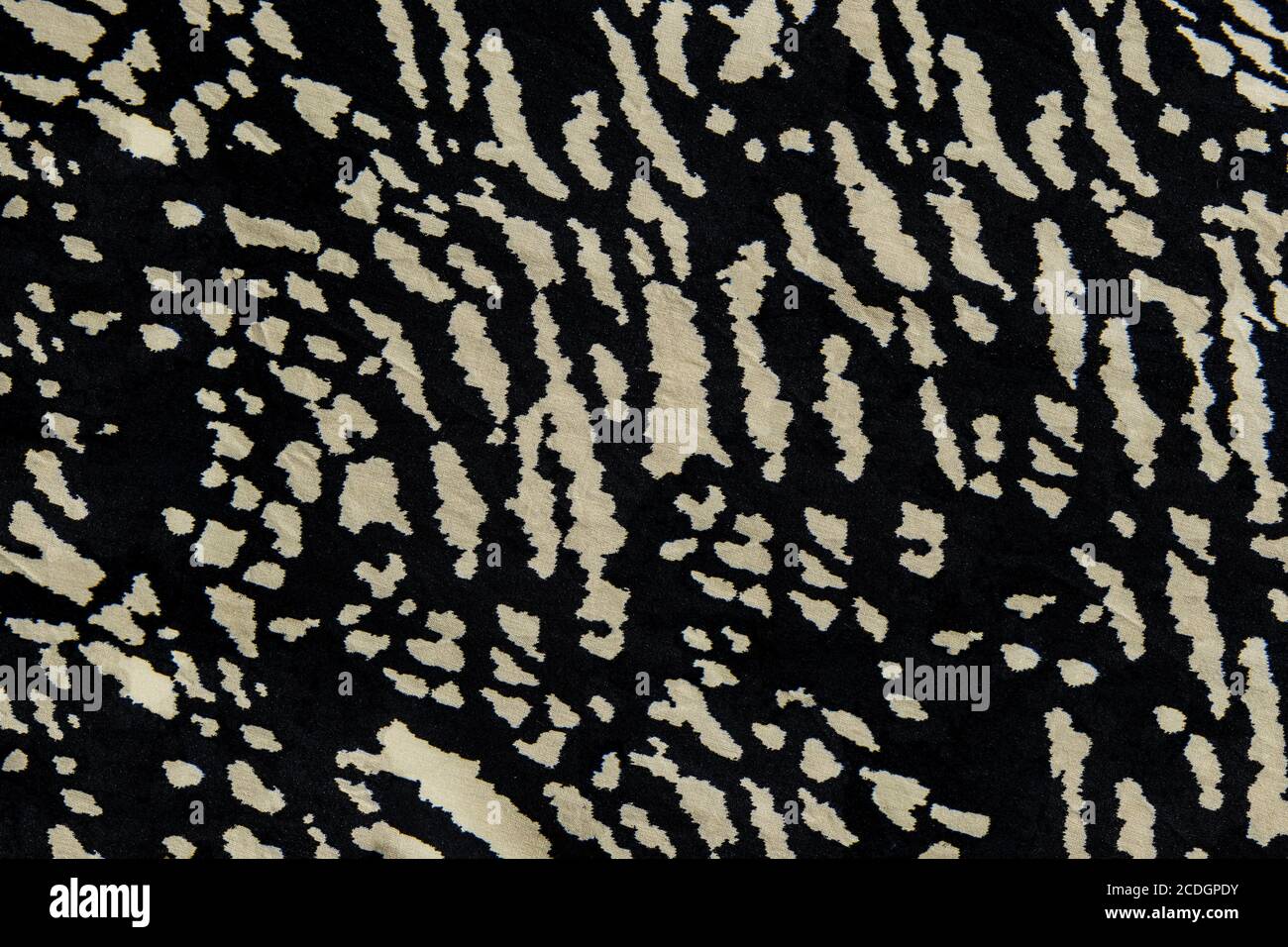 Leopard pattern fabric texture - close up of black fabric with pale ...