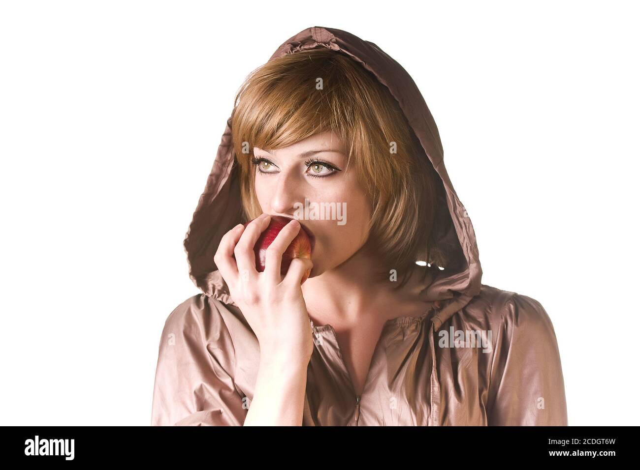 beautiful woman eating an apple on the isolated wh Stock Photo - Alamy