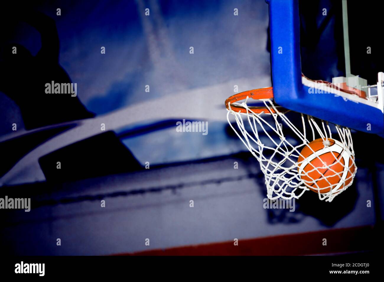 Basketball net and the ball which has got to it Stock Photo - Alamy