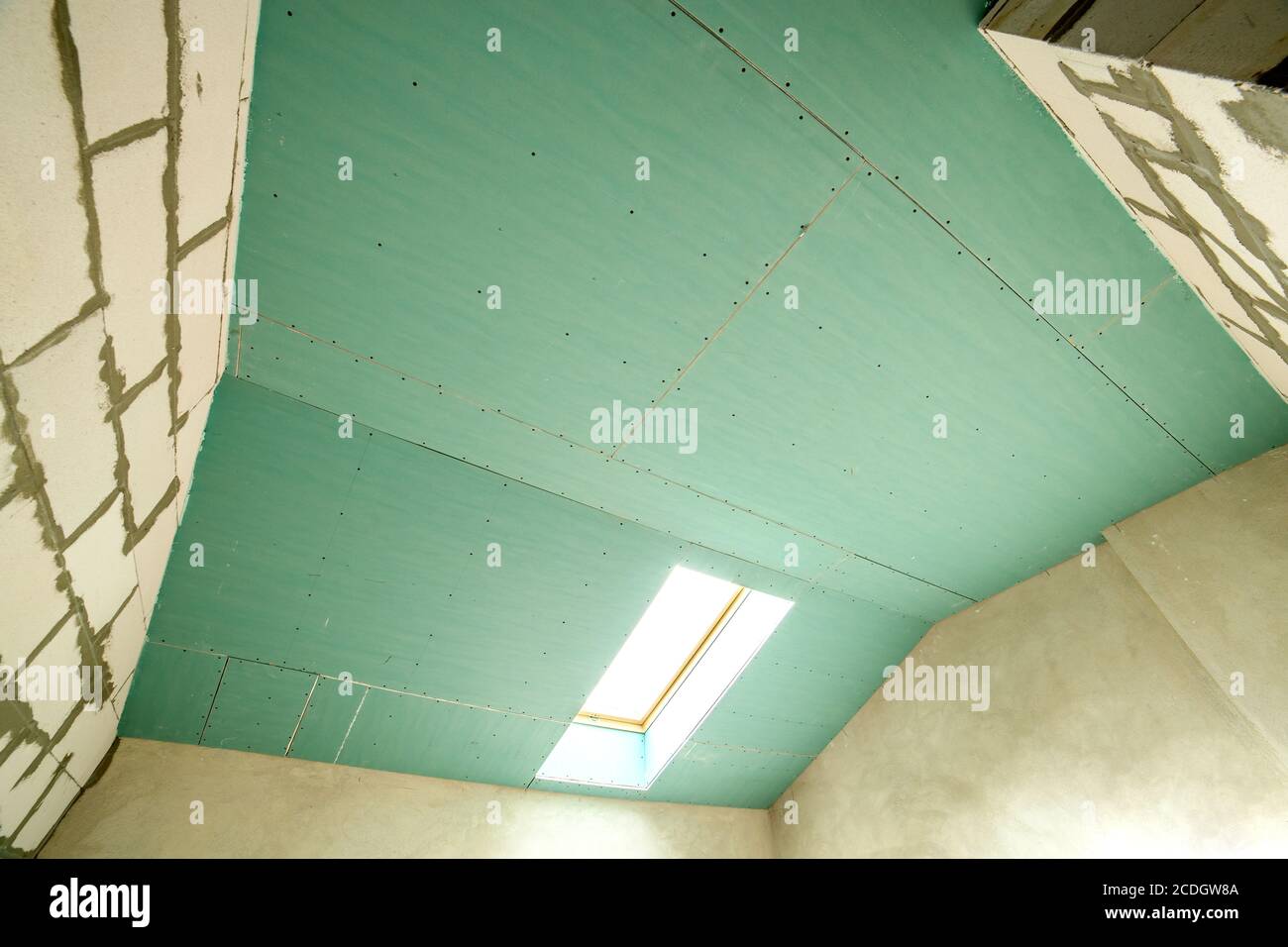 Interior of an apartment room with bare walls and ceiling under ...