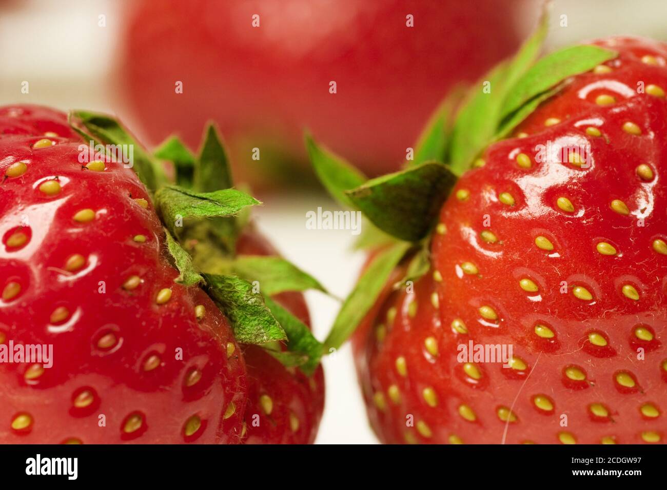 Two appetizing brightly red and juicy strawberries Stock Photo - Alamy