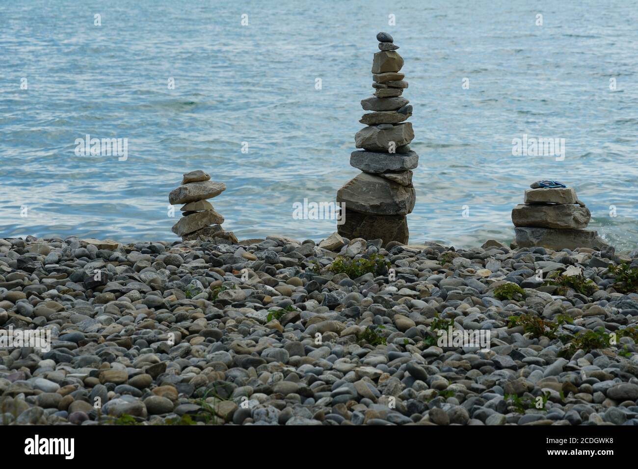 Rock towers built from boulders situate on shore of the lake Constance ...