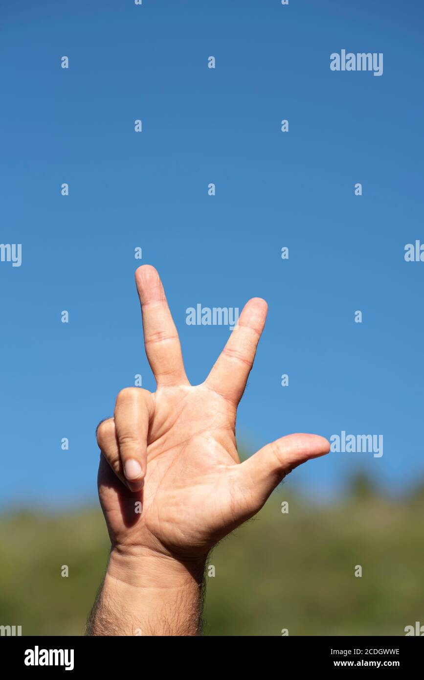 Finger counting three hand gesture hi-res stock photography and images - Alamy