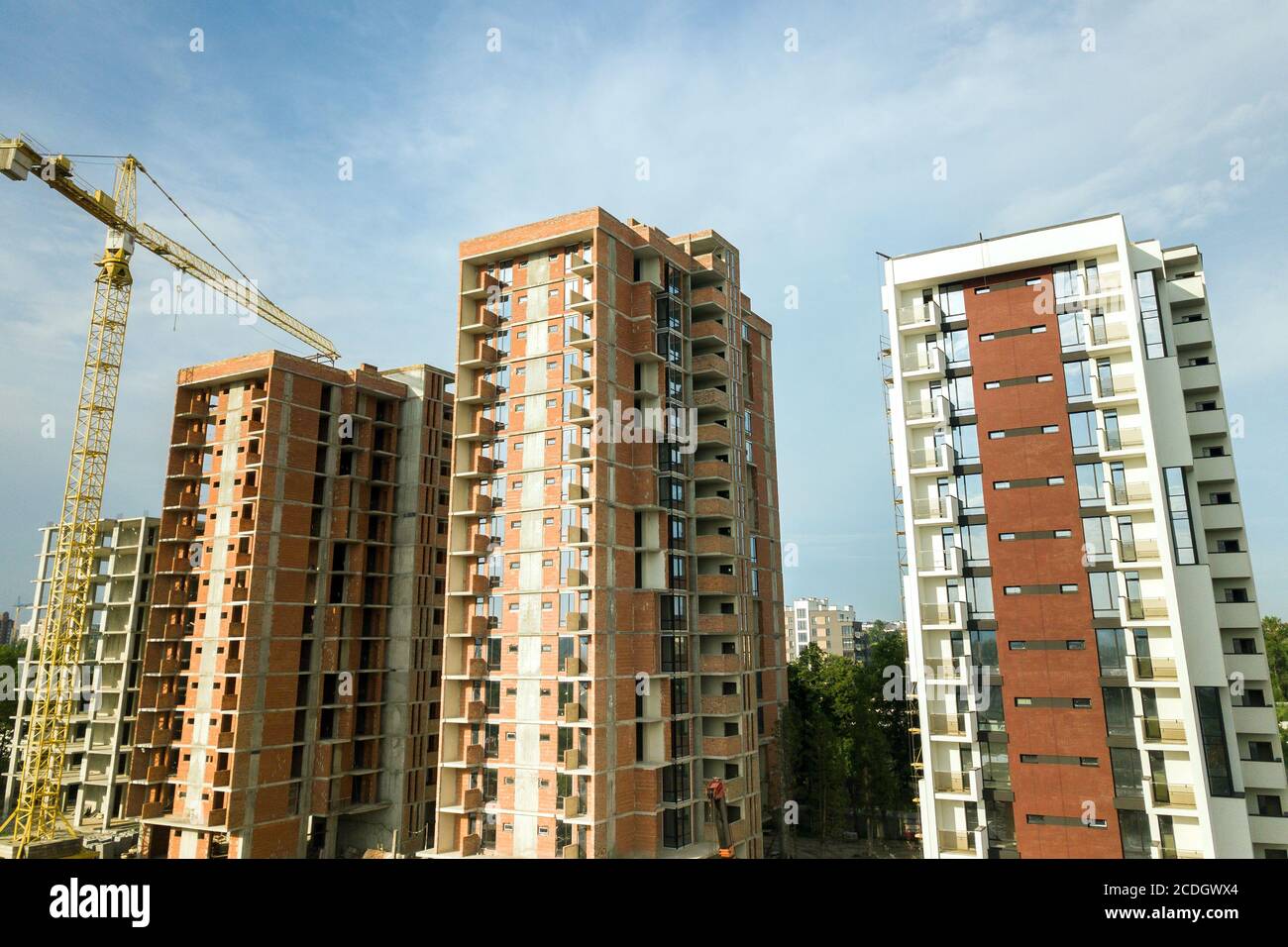 High-rise residential apartment buildings and tower crane under ...