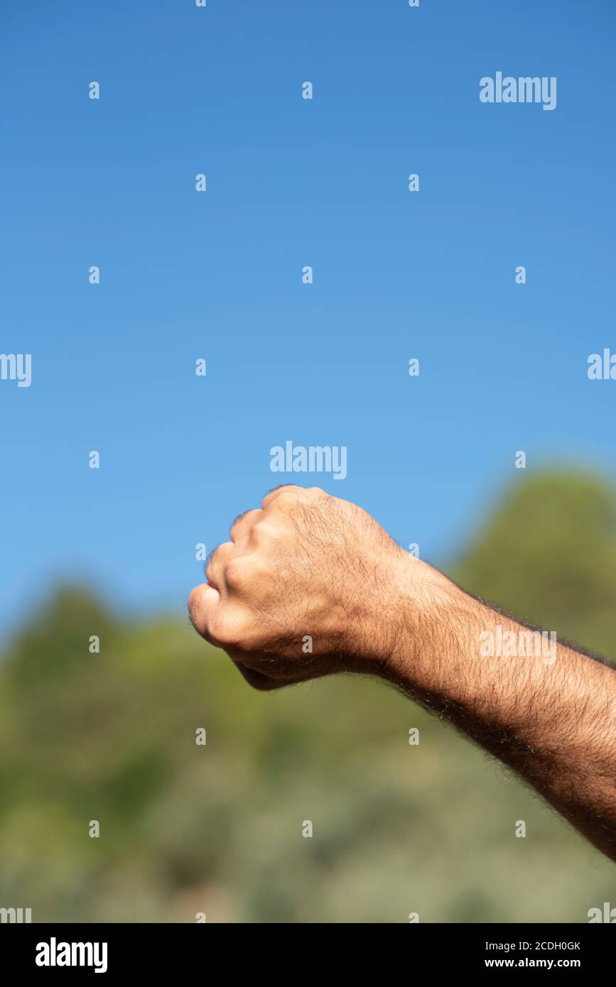 Man's clenched fist Stock Photo - Alamy