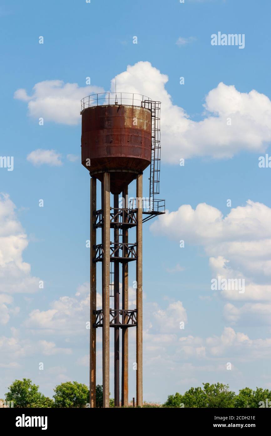 Old rusty water tower in the green field Stock Photo - Alamy