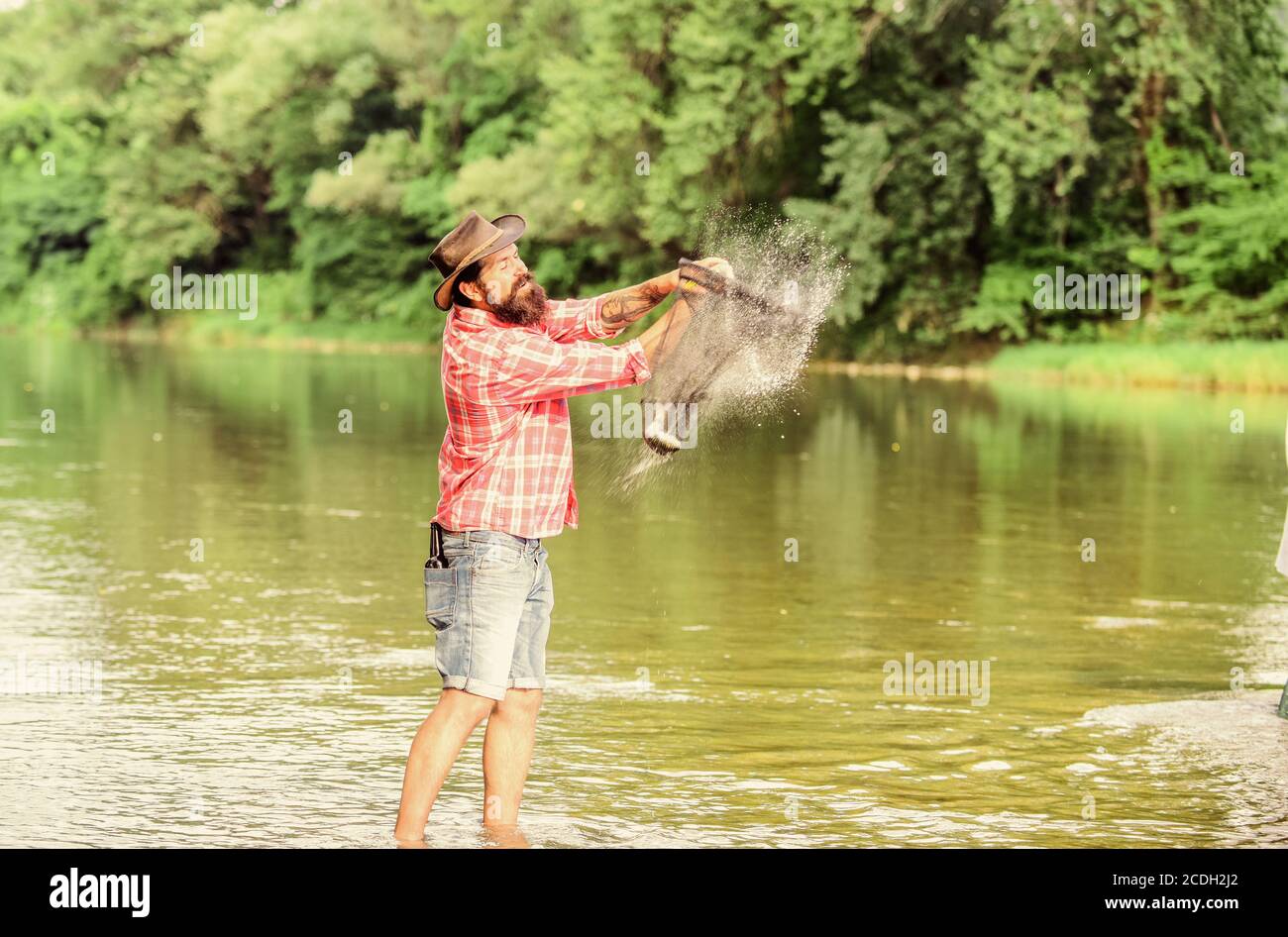 Trout farm. Fisherman alone stand in river water. Man bearded fisherman ...