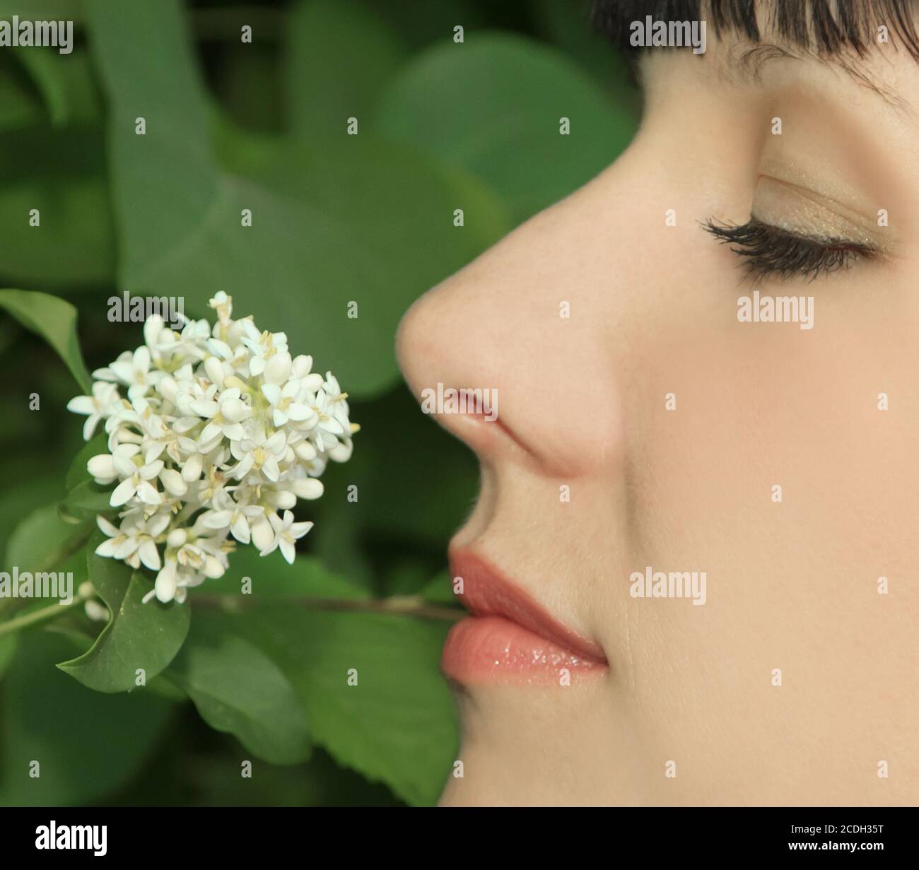 Young Woman Enjoying Smelling aroma Flowers Stock Photo - Alamy