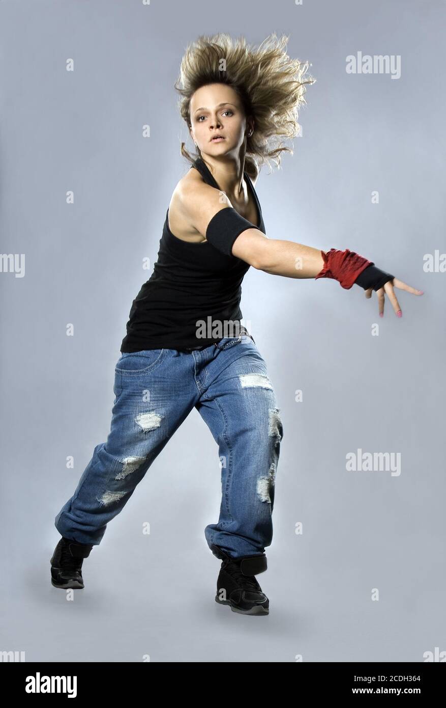 Teenage girl dancing breakdance in action Stock Photo - Alamy