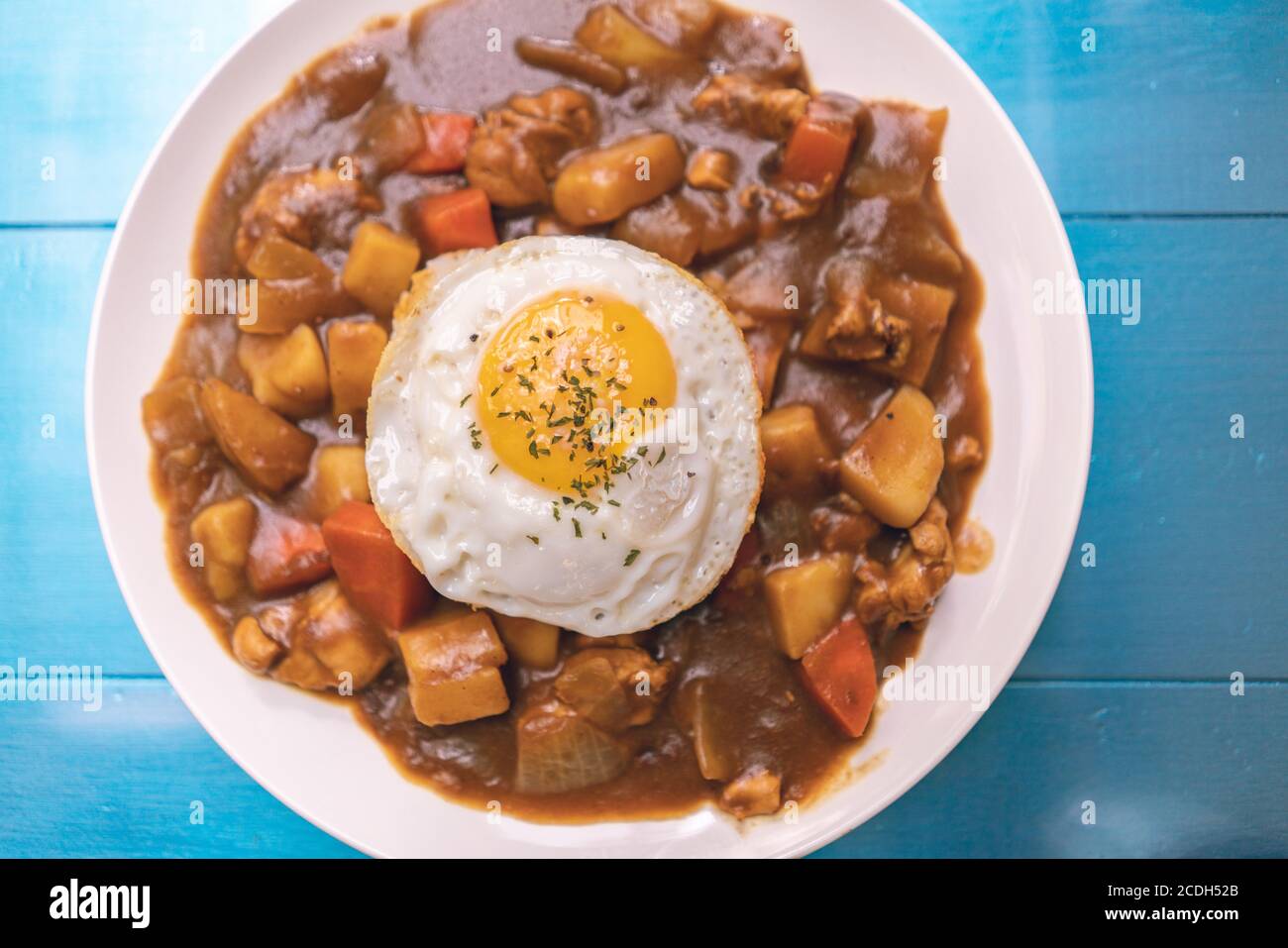 Curry Donburi ( Japanese dish consisting of a bowl of rice topped with ...