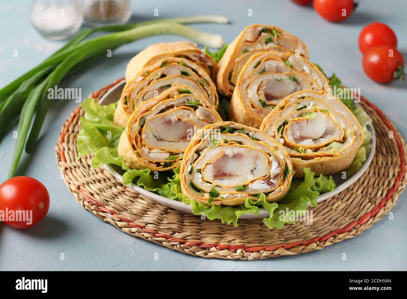 Pita roll with herring, potatoes and onions on light blue background ...