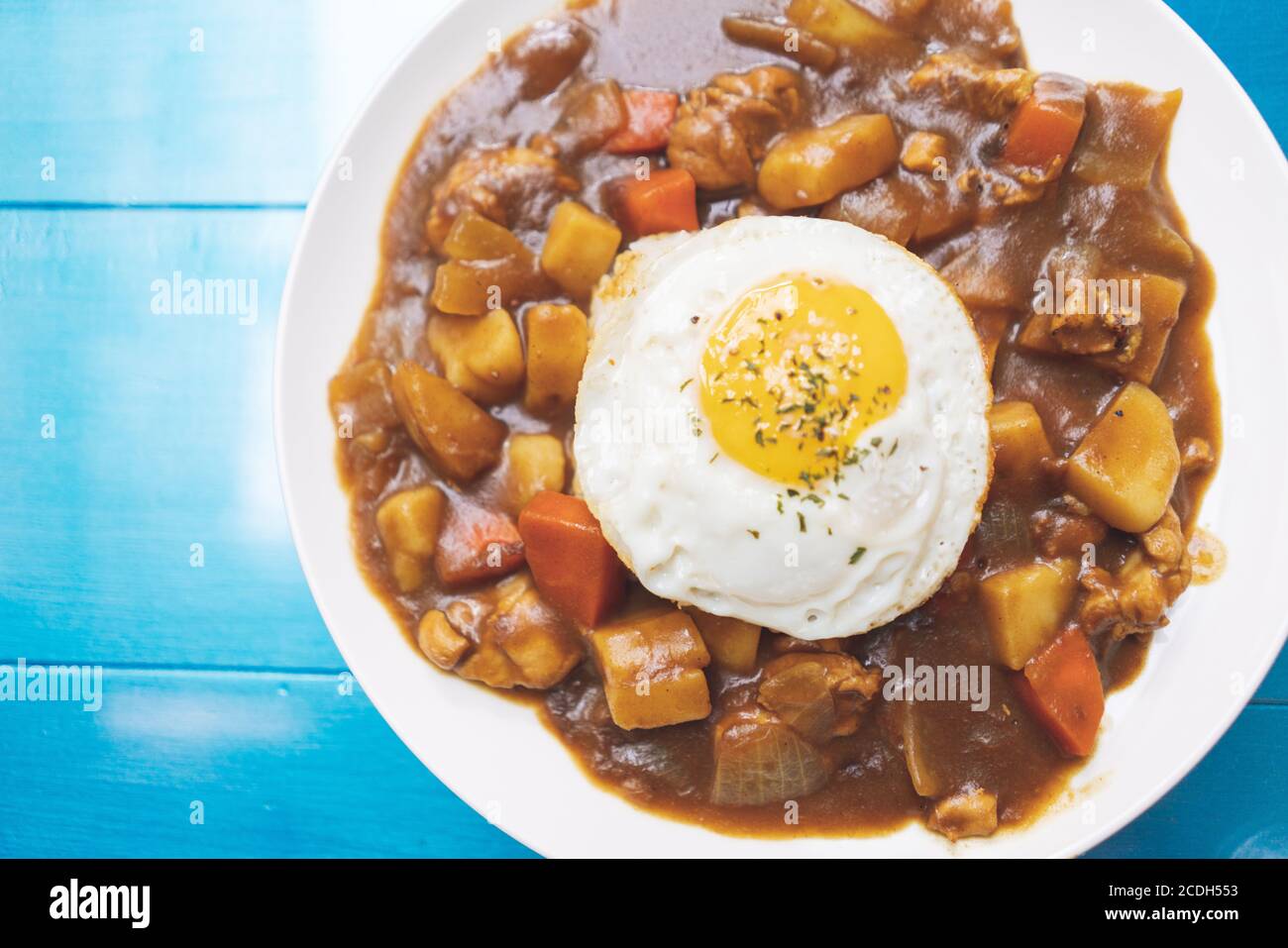 Curry Donburi ( Japanese dish consisting of a bowl of rice topped with ...