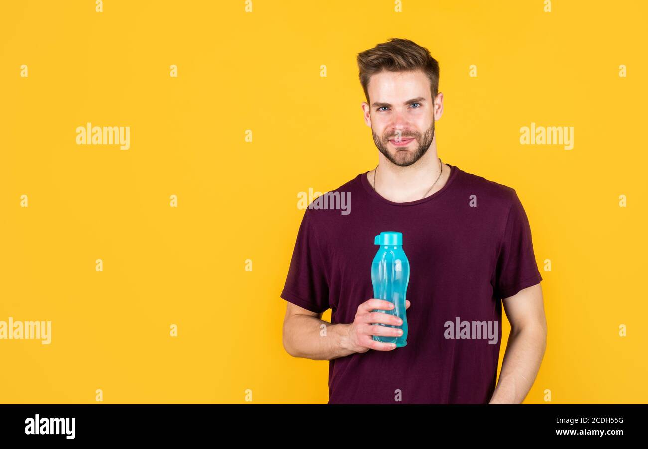 Hydrate copy space. man drink water after active training. handsome guy ...