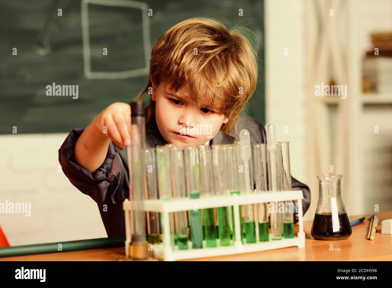 Genius pupil. Chemical analysis. Science concept. Wunderkind ...