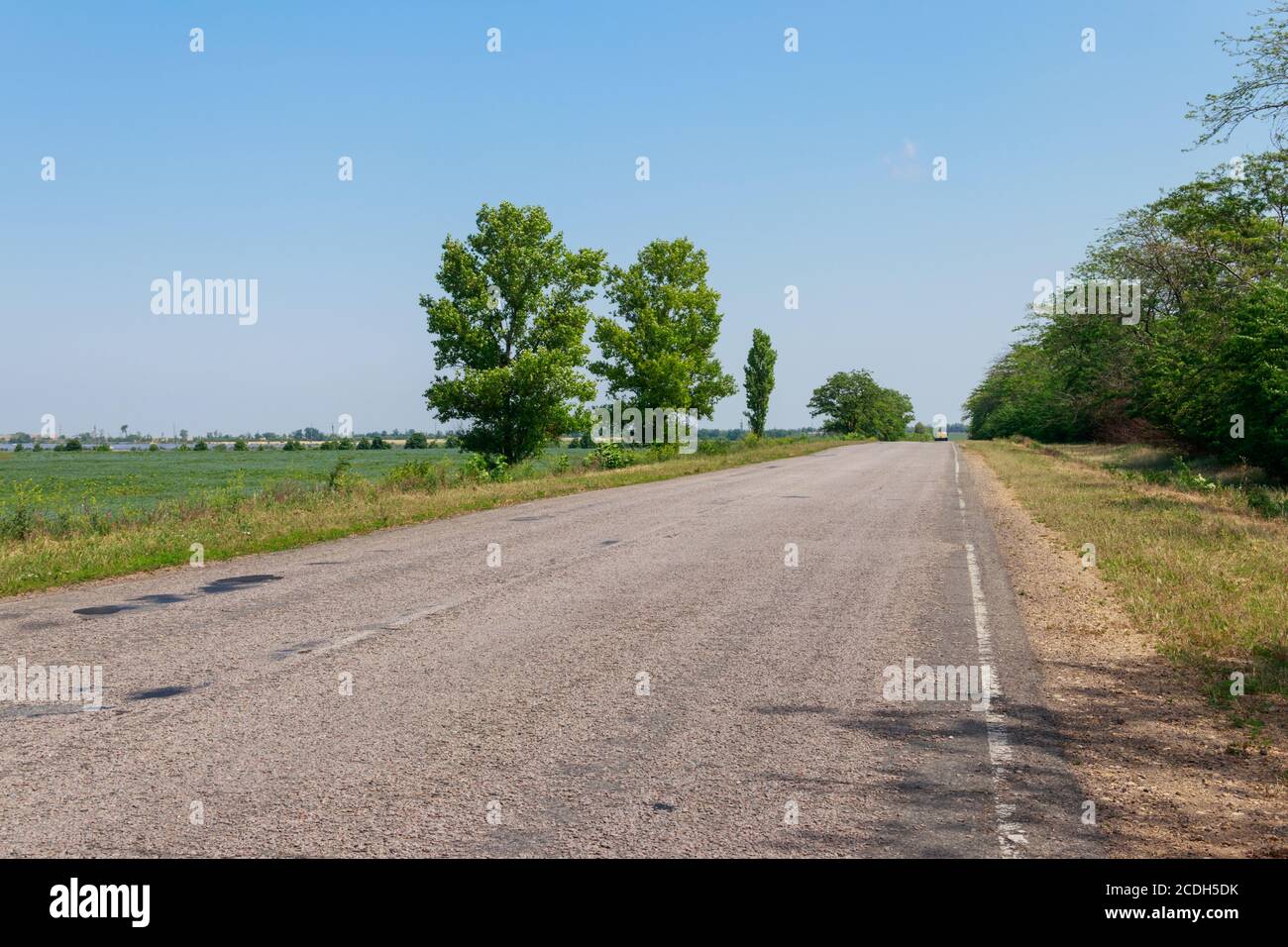 Summer landscape with country asphalt road and blue sky Stock Photo - Alamy
