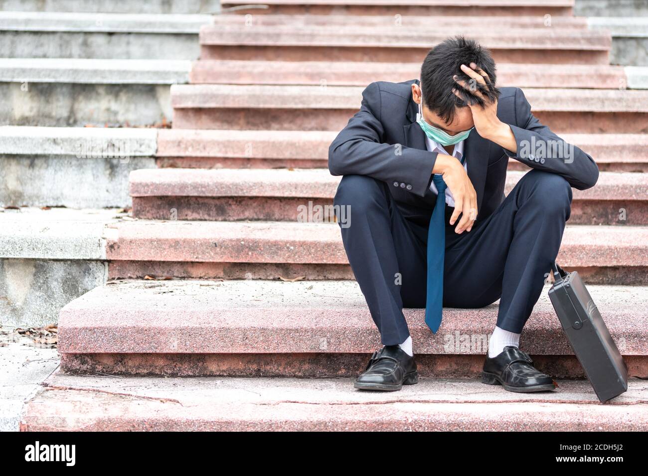 Failure unemployed stressed young asian business man in suit and ...